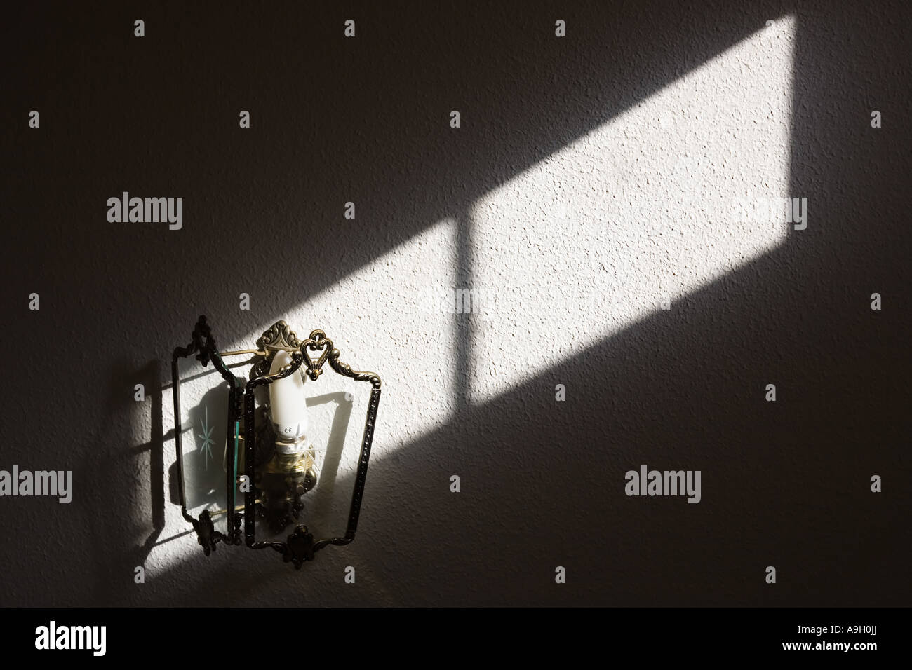 Broken wall lamp Stock Photo - Alamy