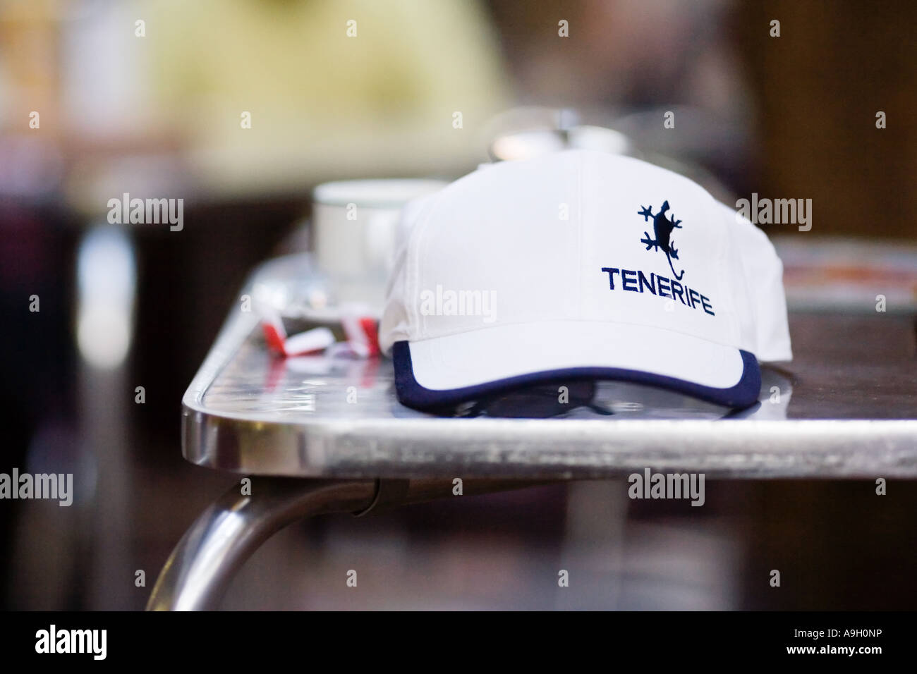 Baseball cap over table Stock Photo - Alamy