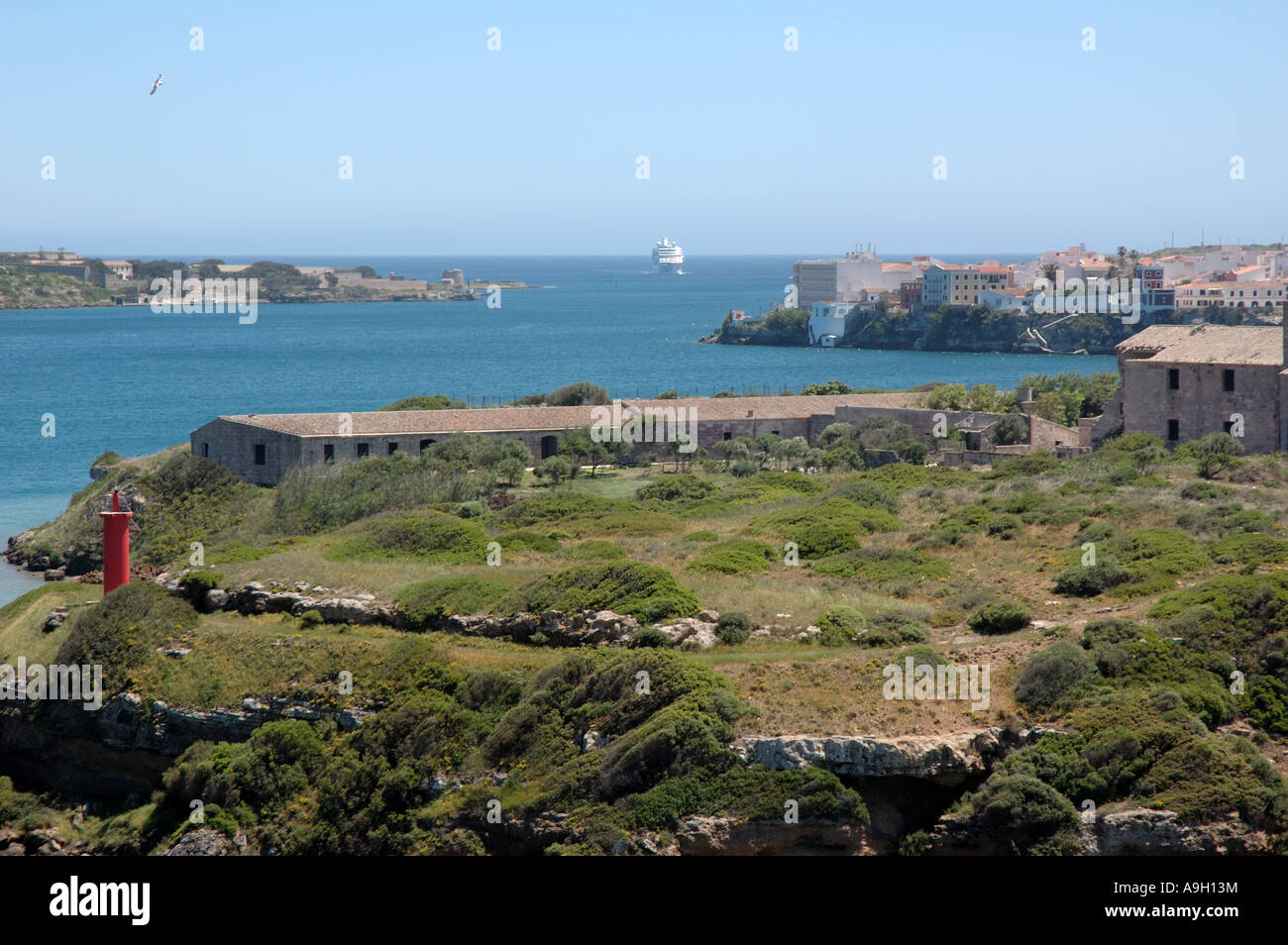 Cruise ship Regatta approaching the entrance to Mahon harbour, Menorca ...