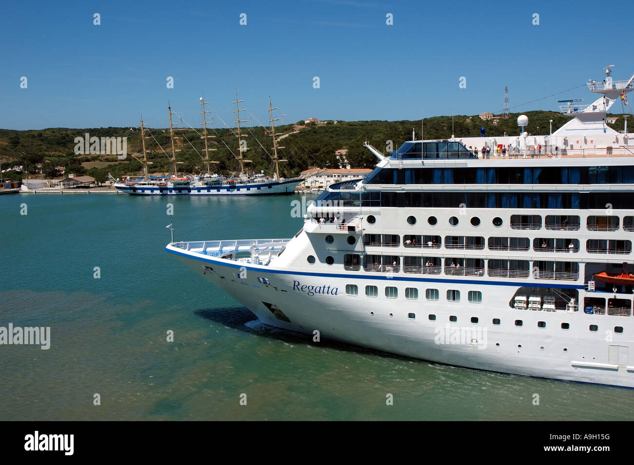 Cruise ship Regatta passes the five-masted sailing ship Royal Clipper ...