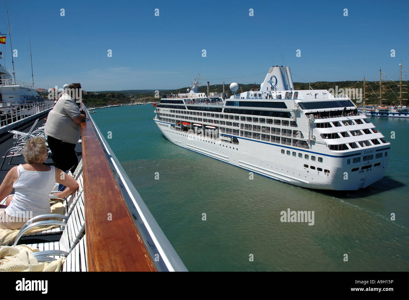 Cruise ship Regatta coming alongside in Mahon harbour Stock Photo - Alamy