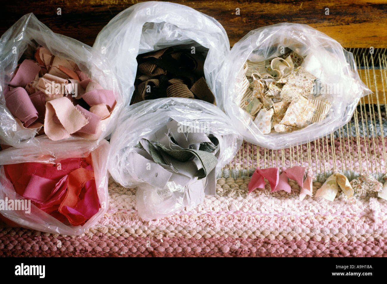 Strips of pink brown and grey rags on a loom Rag rugs by Alison Morton ...