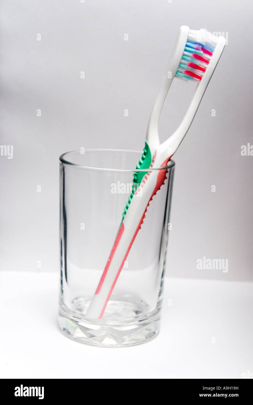 Toothbrushes in glass Stock Photo - Alamy
