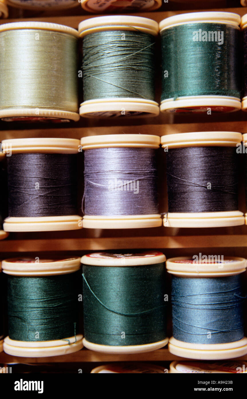 Reels of green and grey thread Stock Photo - Alamy