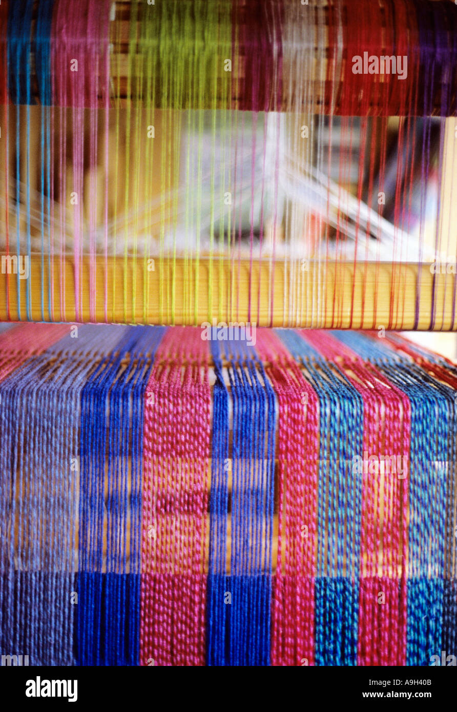 Weaving warp and weft on the loom Stock Photo - Alamy