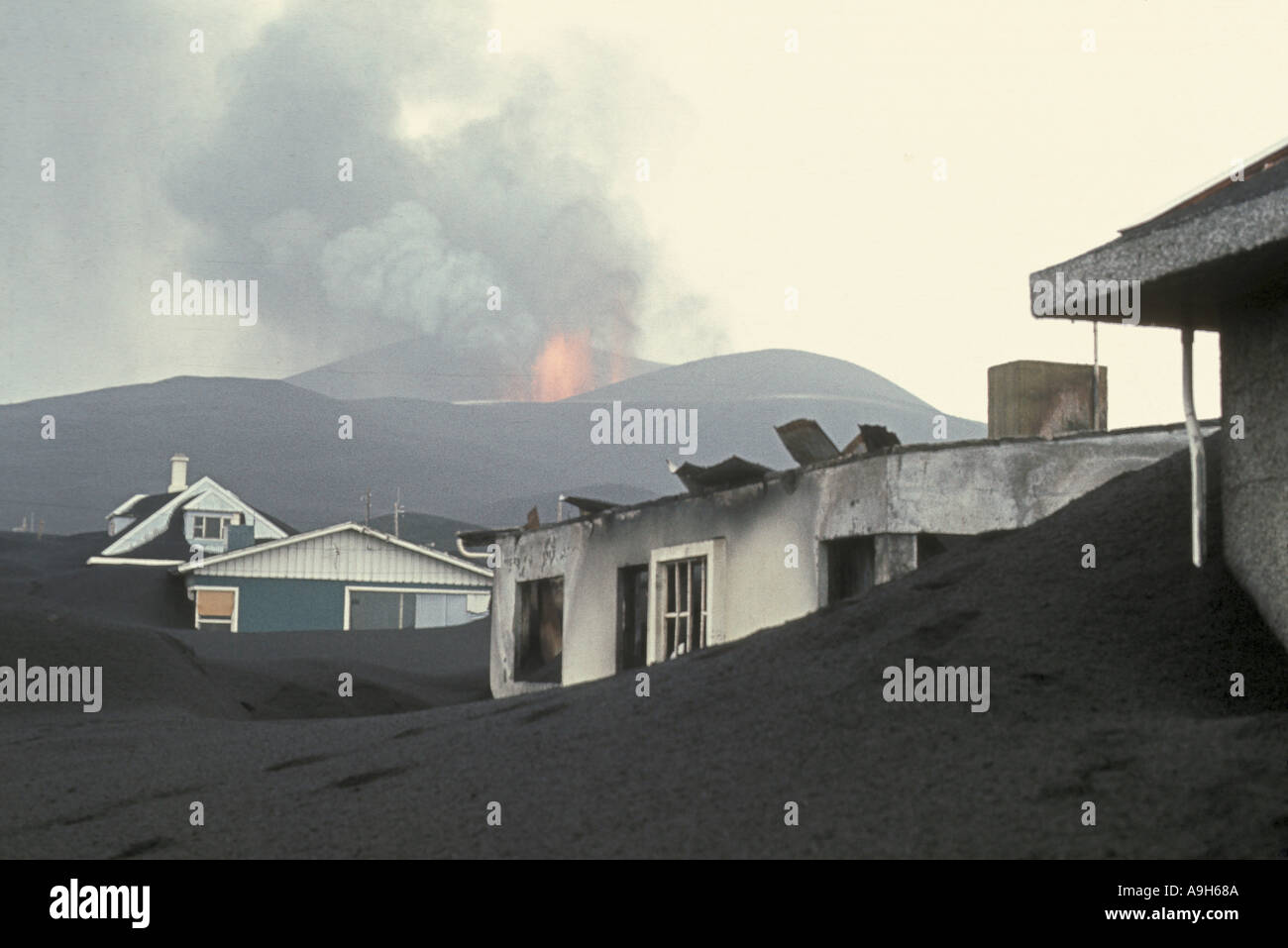 Volcano Iceland Heimaey erupting houses partially buried by ash March ...