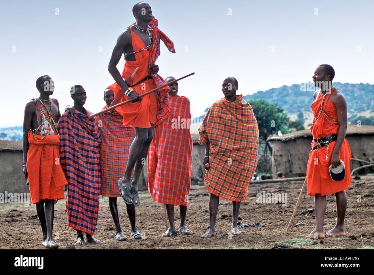 A group of Masai men doing a traditional dance in their village (called ...