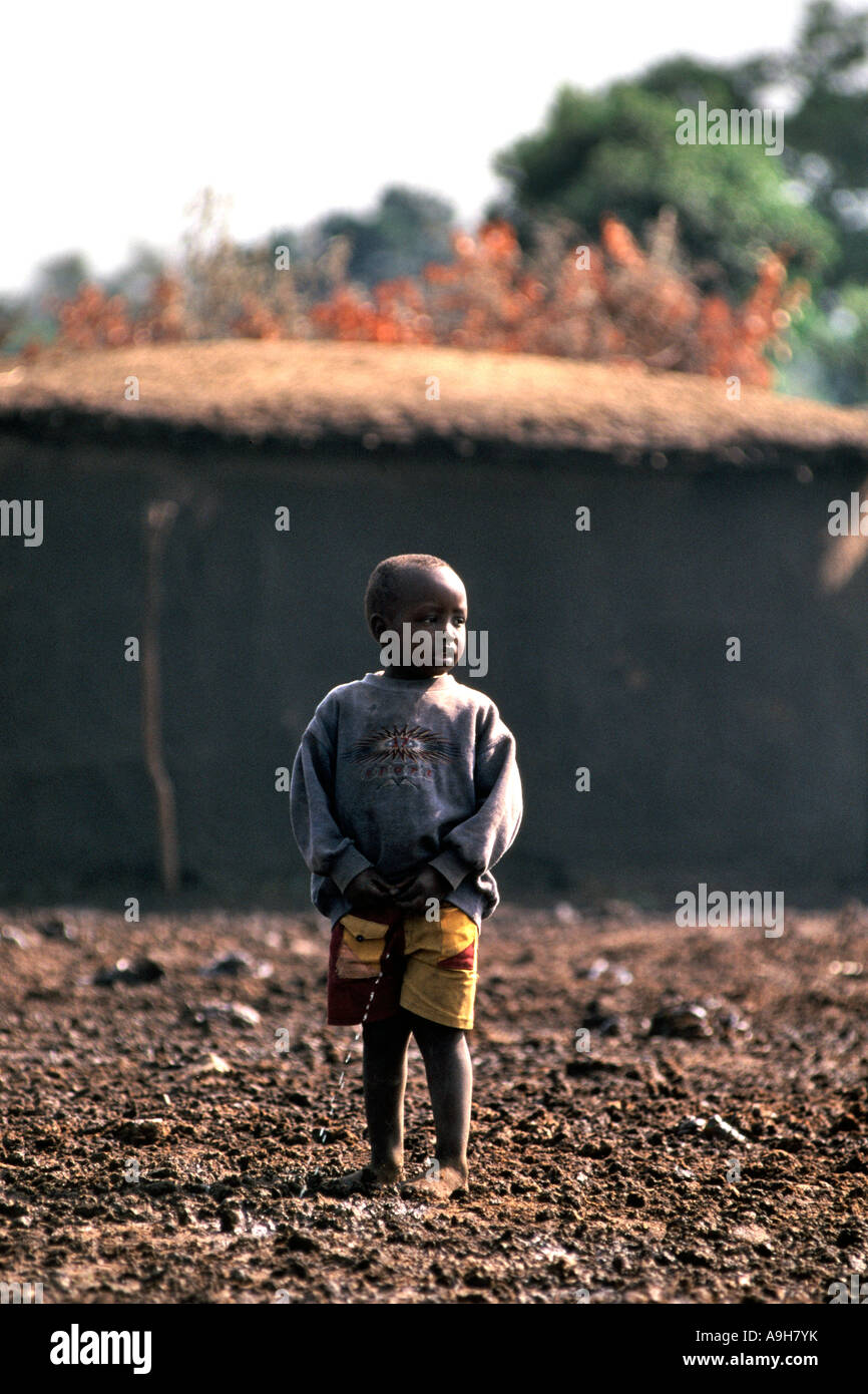 A Masai boy urinating in his village (called a manyatta) in the Masai ...