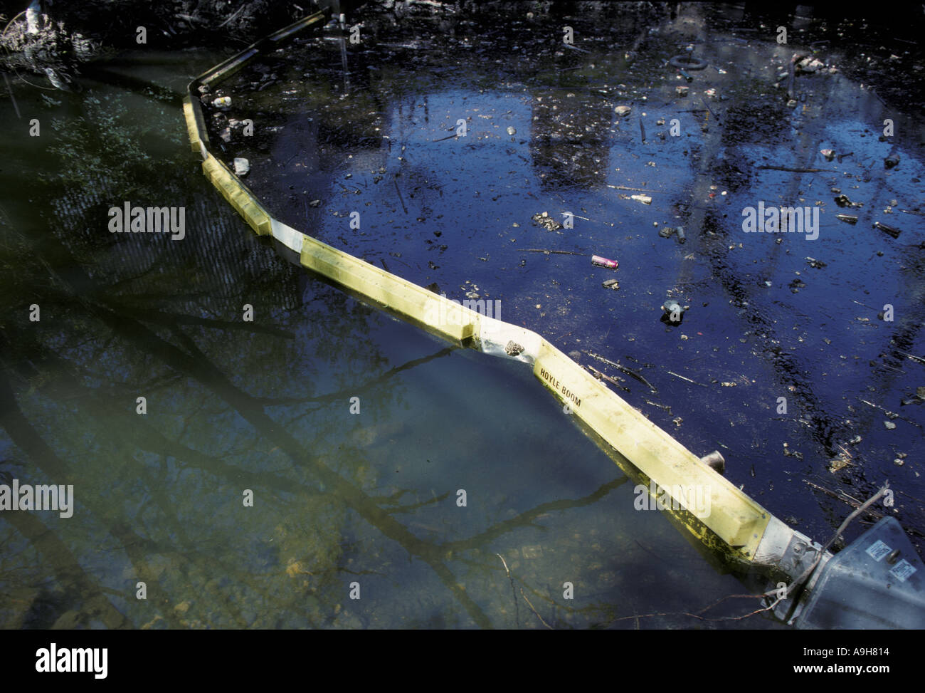 Pollution River Pond Oil boom operating with clear water polluted water ...