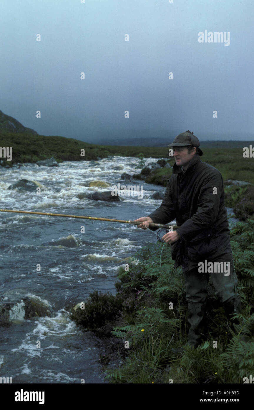 Sports Pastimes Angling Angler fishing for salmon in fast flowing river ...