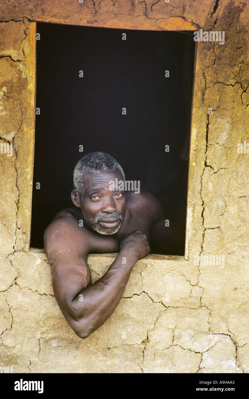A man in adobe house living in a rainforest village in the remote ...