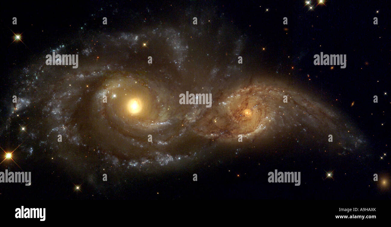 Interacting Spiral Galaxies NGC 2207 and IC 2163 from the Hubble Space Telescope Stock Photo - Alamy