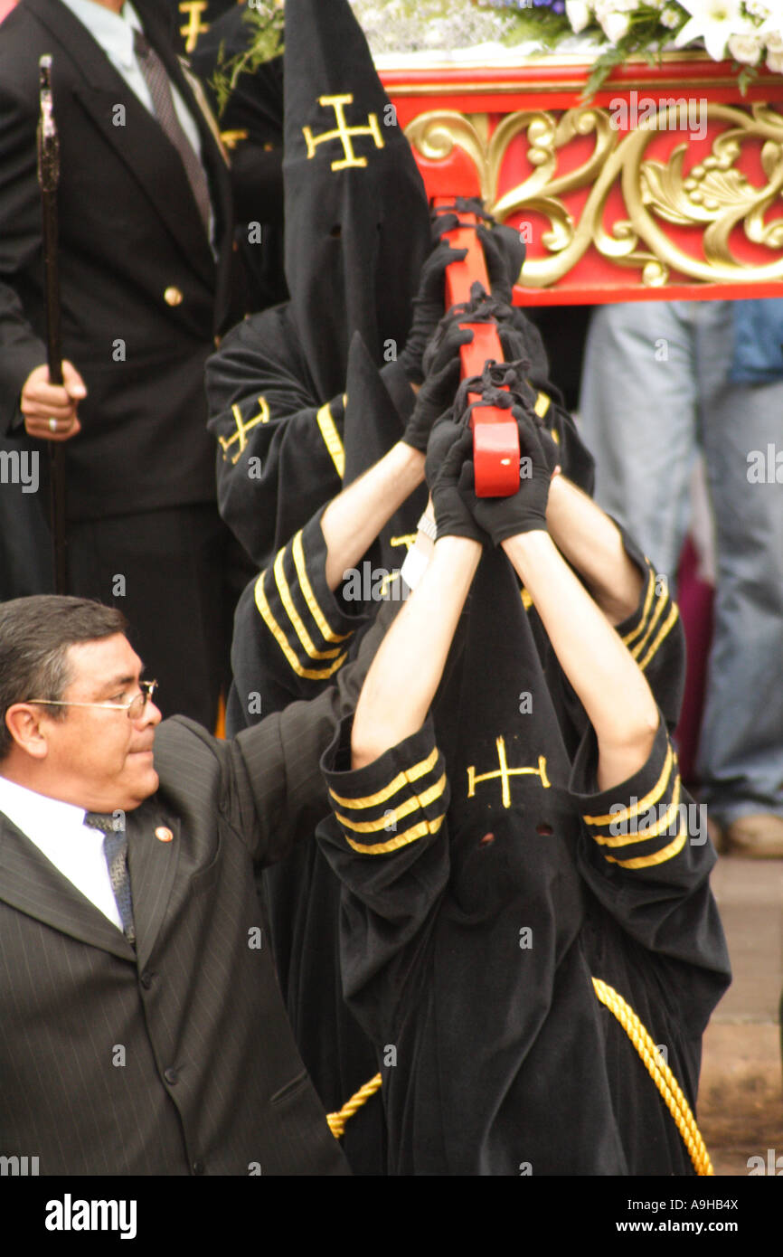 men carrying a traditional litter in a catholic procession, Tunja ...