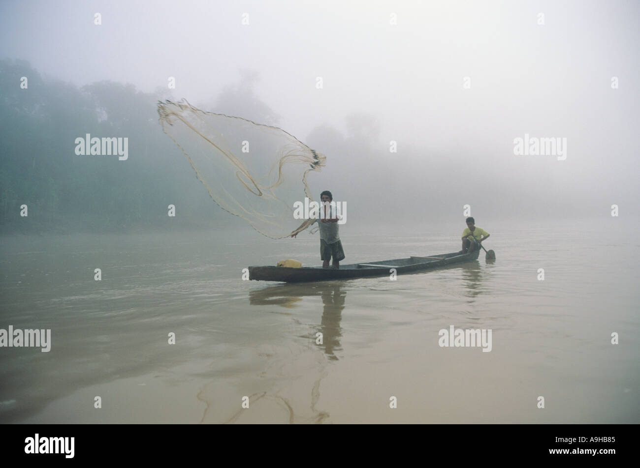 fisherman cast net fishing on the remote Purus River in the Amazon ...