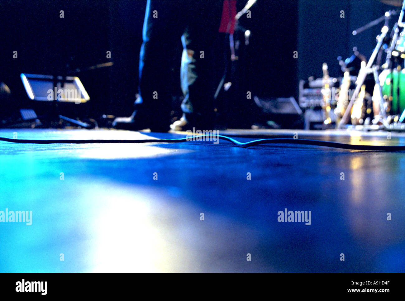 legs and feet of performers on stage Stock Photo - Alamy