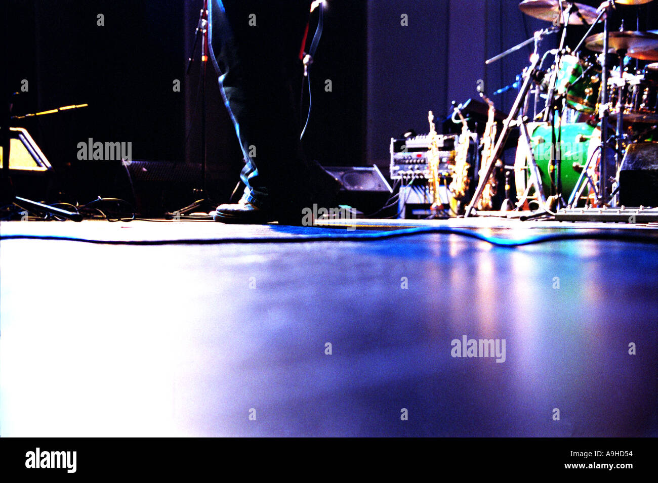 legs and feet of performers on stage Stock Photo - Alamy
