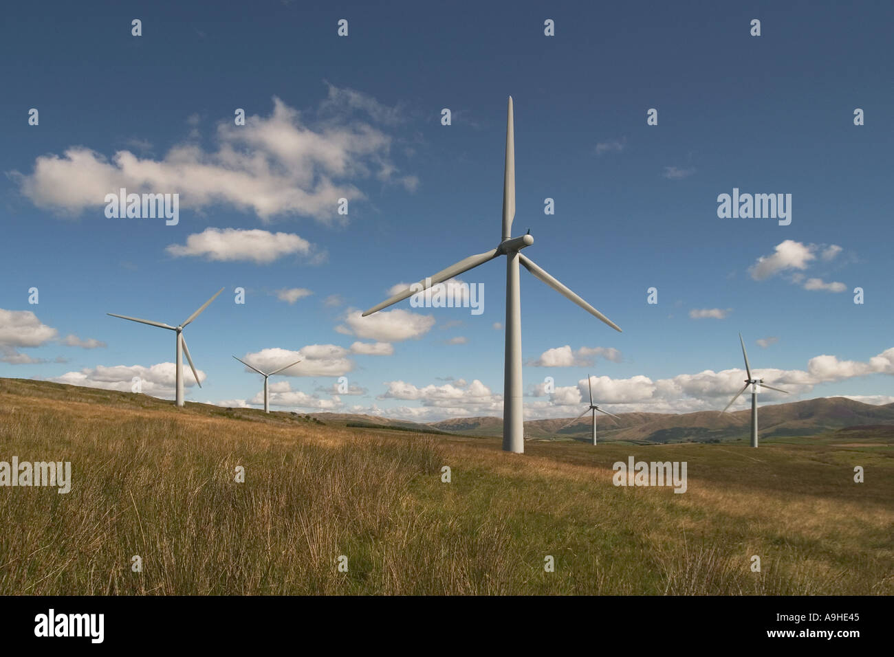 Wind power turbines producing electricity for part of Cumbria UK at ...