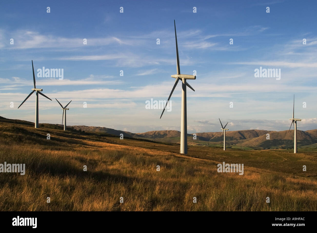 Wind power turbines producing electricity for part of Cumbria UK at ...