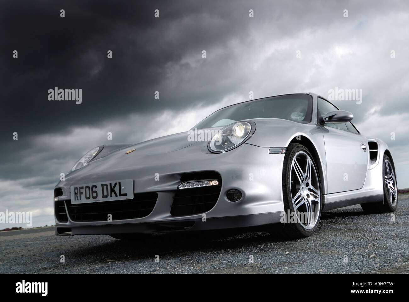 Porsche Turbo under a storm clouded sky Stock Photo - Alamy