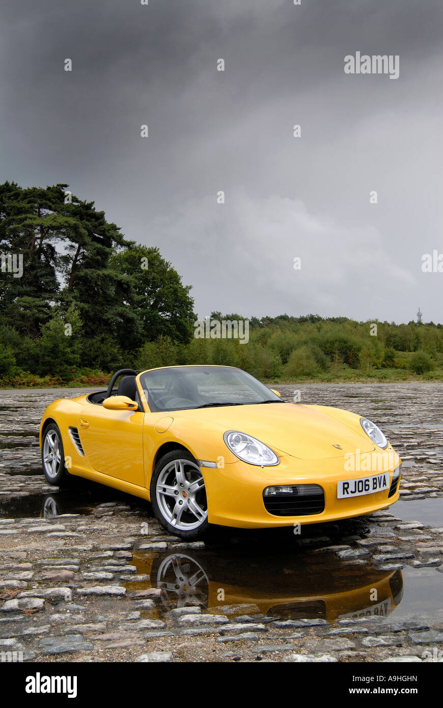 Yellow Sportscar under a stormy sky Stock Photo - Alamy