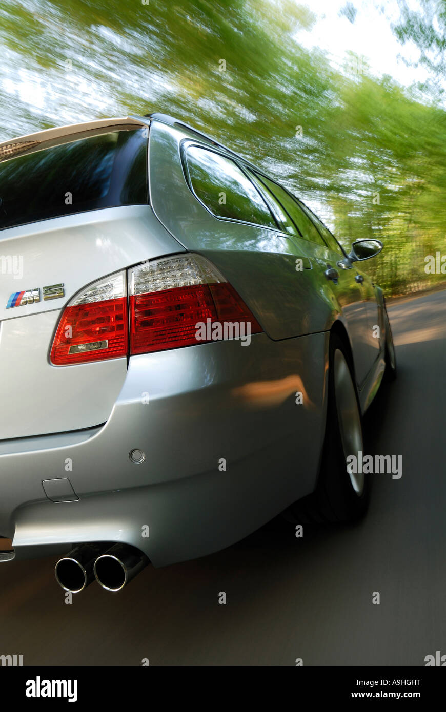 Silver Car driving Stock Photo - Alamy