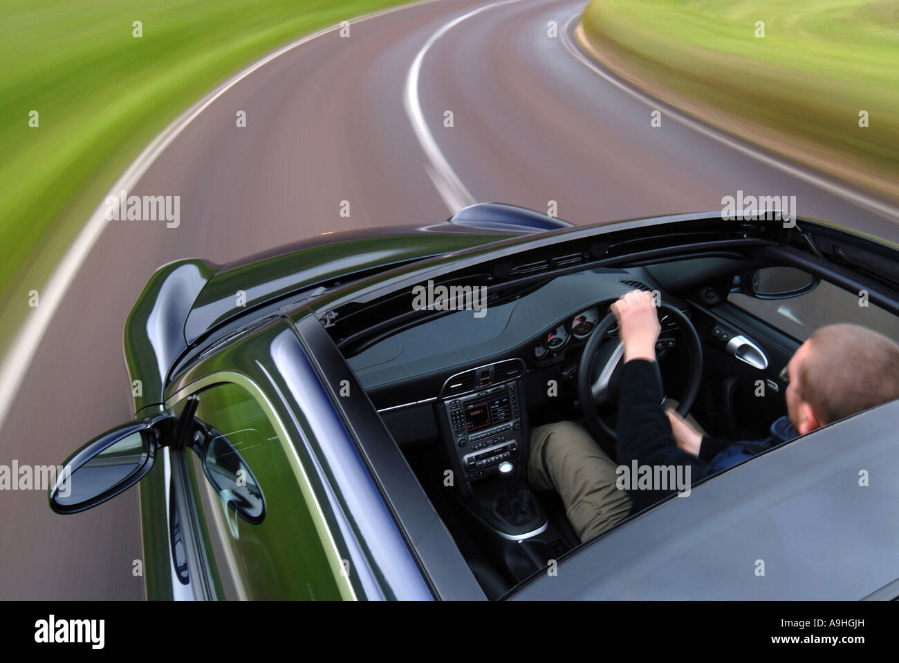 Sportscar corners at speed Stock Photo - Alamy