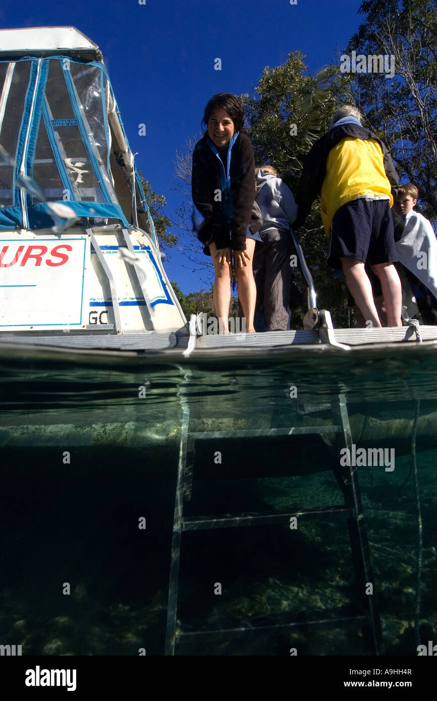 Snorkelers on board a pontoon boat and ladder Crystal River Florida USA ...