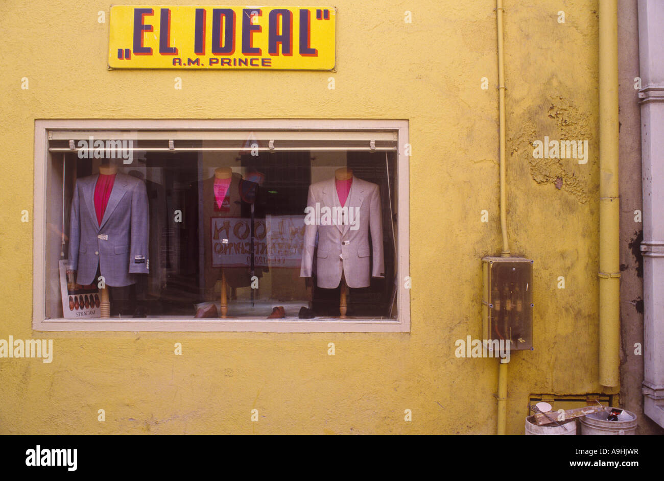 Window detail from back alley grated window of a clothing store in ...