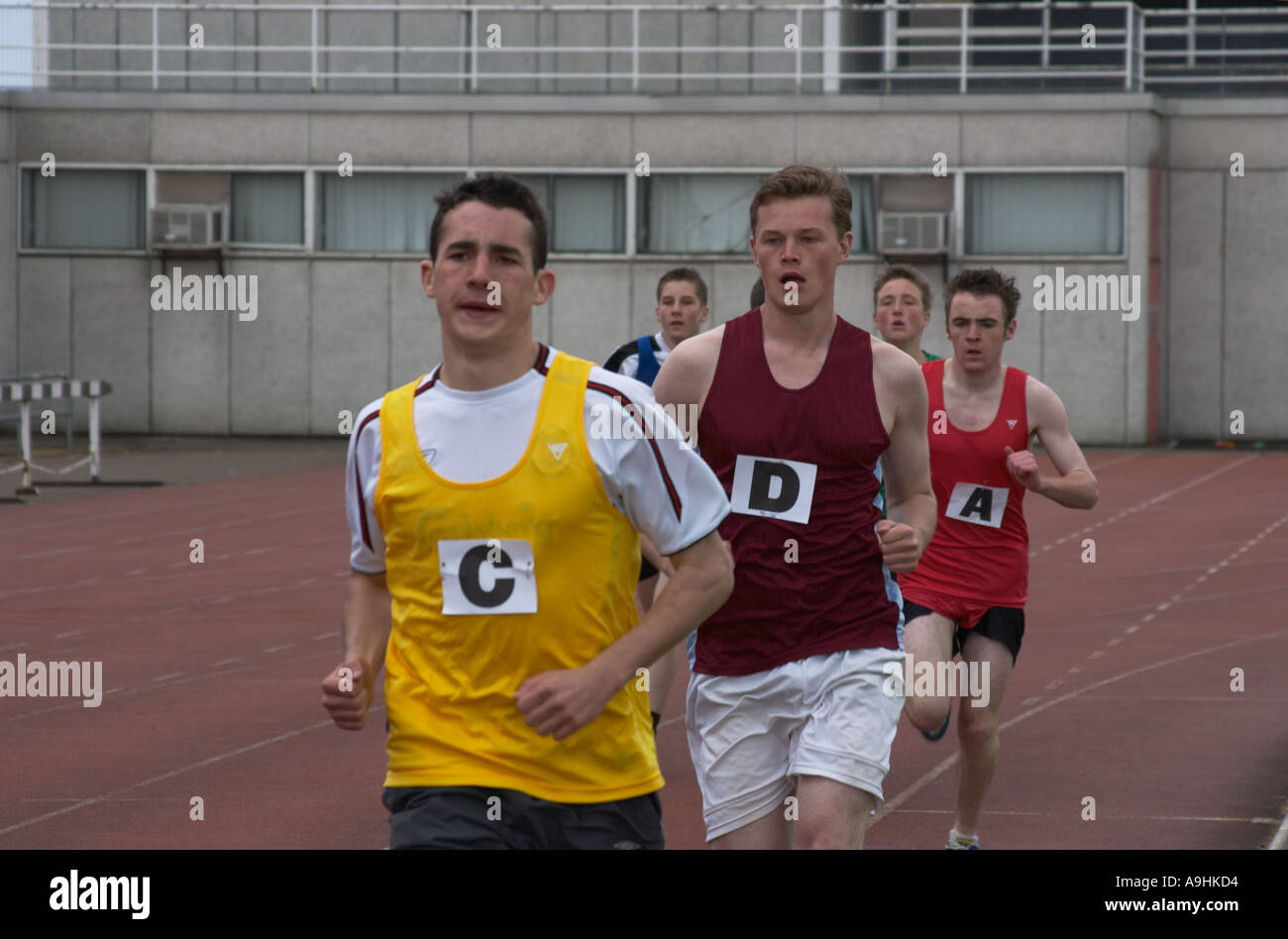 Young male athletes running on a track event Stock Photo - Alamy