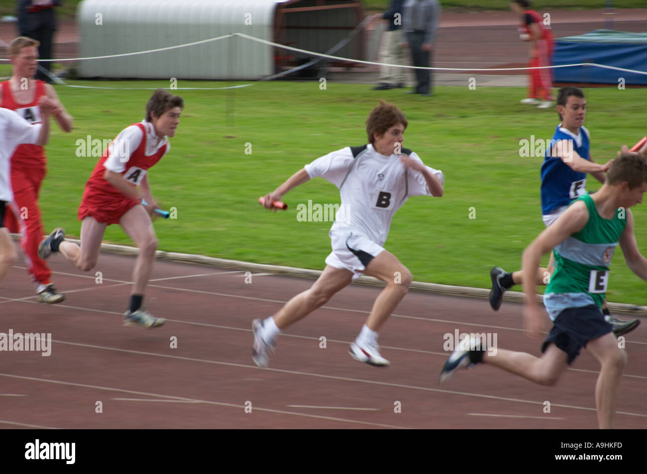 Male athletes running in relay hi-res stock photography and images - Alamy