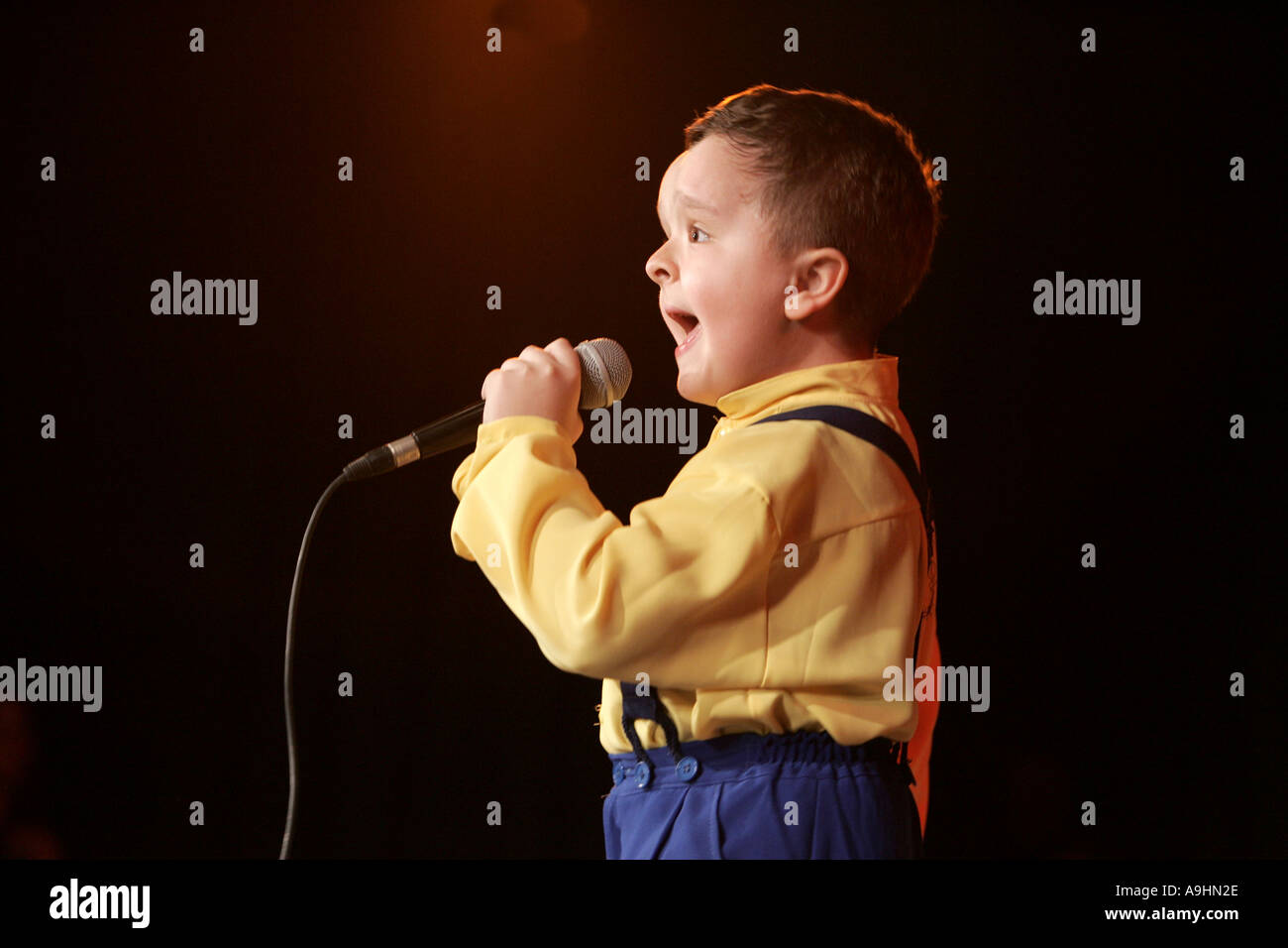 Boy Singing On Stage