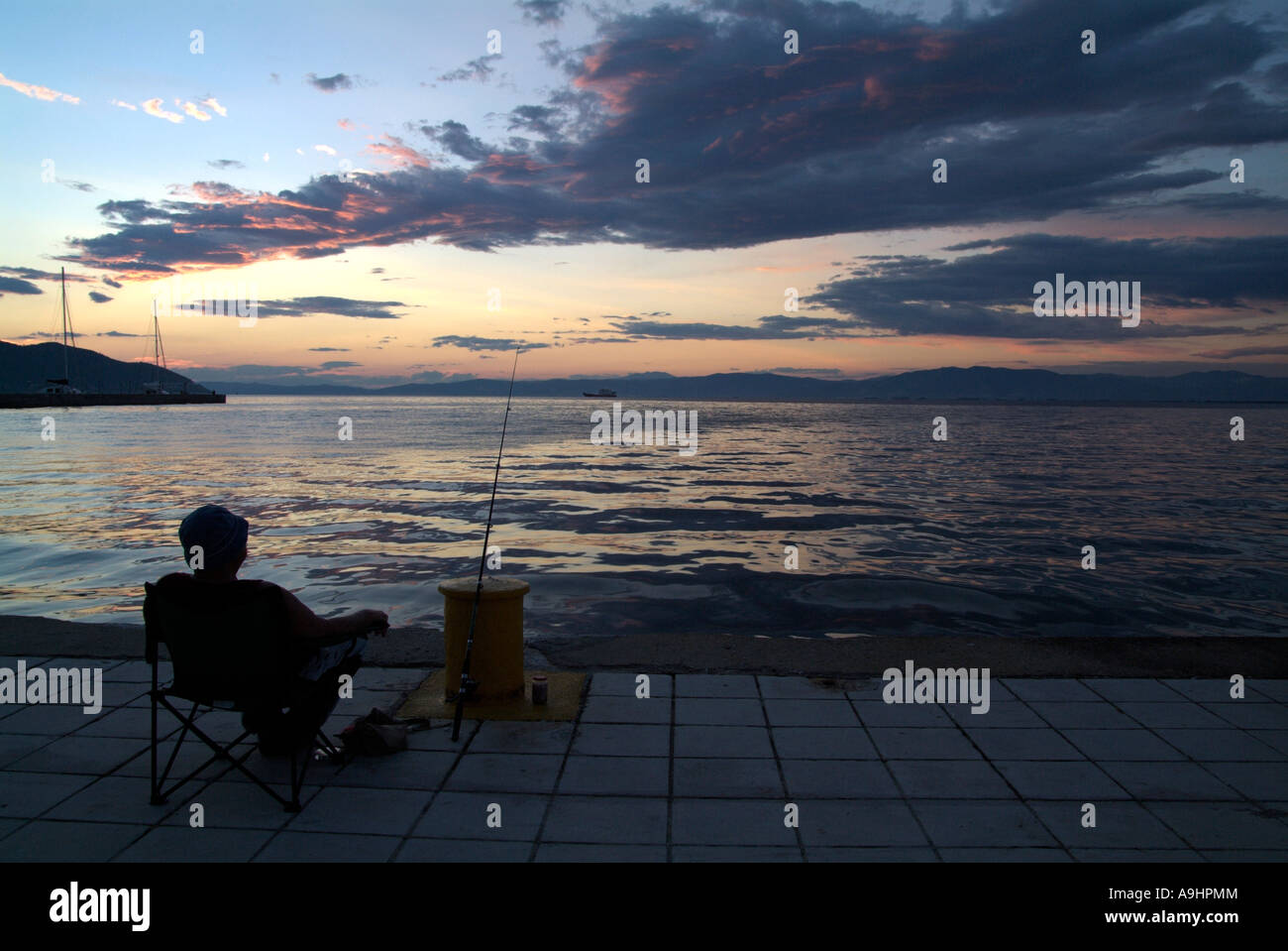 Man relaxing in chair fishing hi-res stock photography and images - Alamy