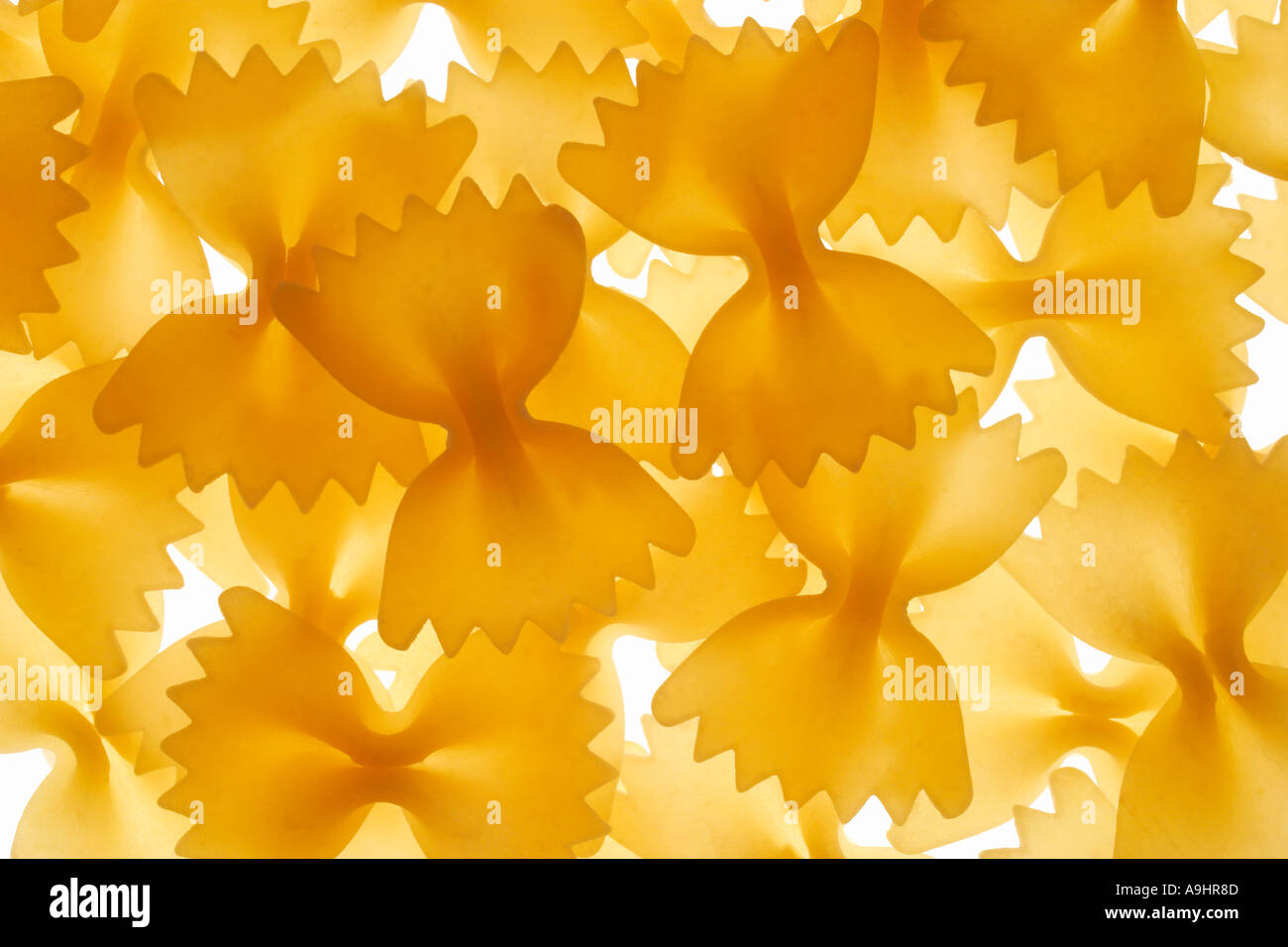 Pasta shapes backlit on white background Stock Photo - Alamy