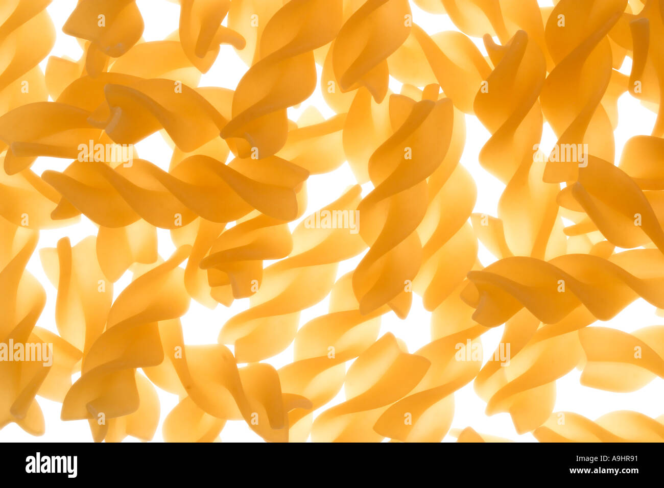 Pasta shapes backlit on white background Stock Photo - Alamy