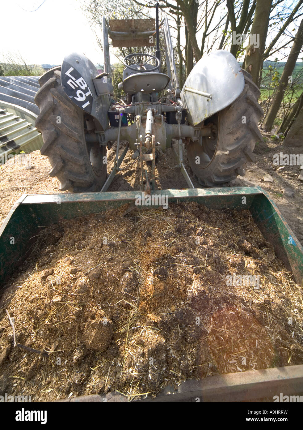 Tractor in Yorkshire UK with a trailor full of manure Stock Photo - Alamy
