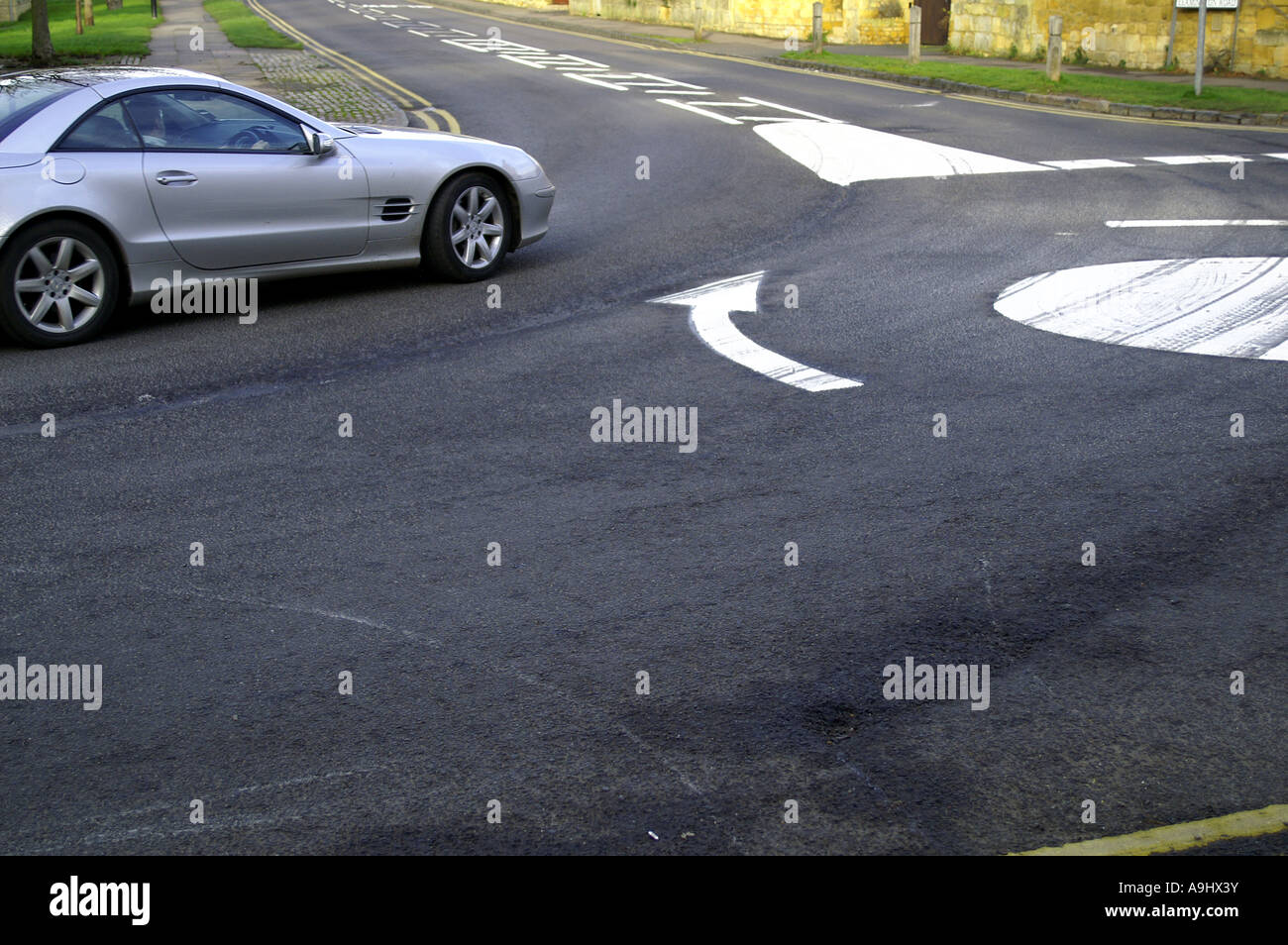 silver sport car on the roundabout Stock Photo - Alamy