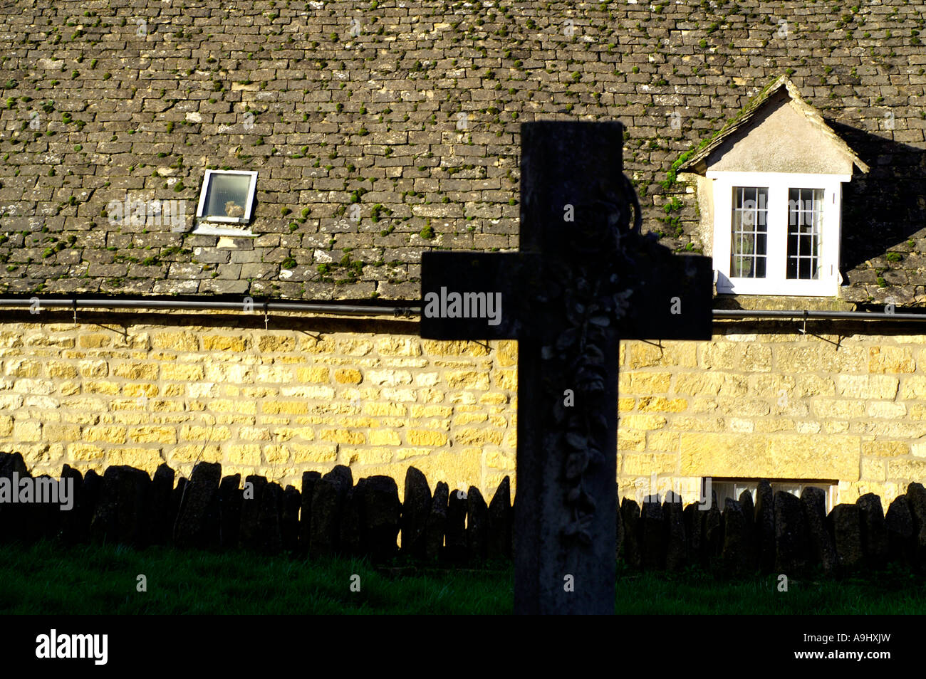 cross in shadow on English traditional churchyard Stock Photo - Alamy