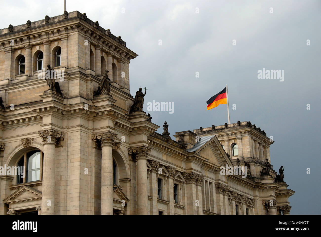 German national flag waves over the building of Reichstag Berlin ...