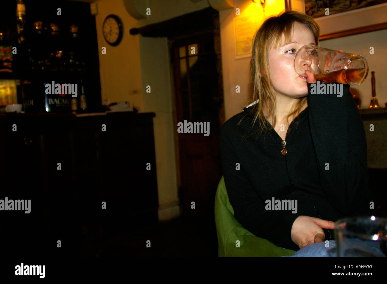 woman drinking beer in English pub, Broadway Stock Photo - Alamy