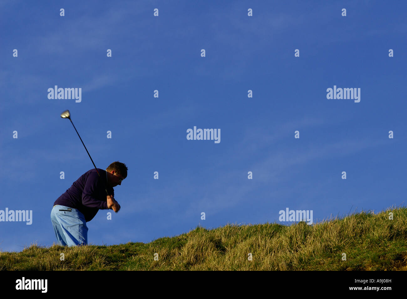 golfer playing golf Stock Photo - Alamy