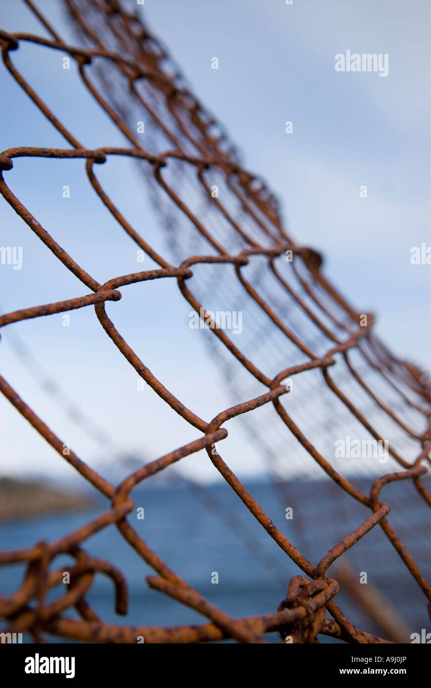 Rusty chain link fence, Lofoten, Norway Stock Photo - Alamy