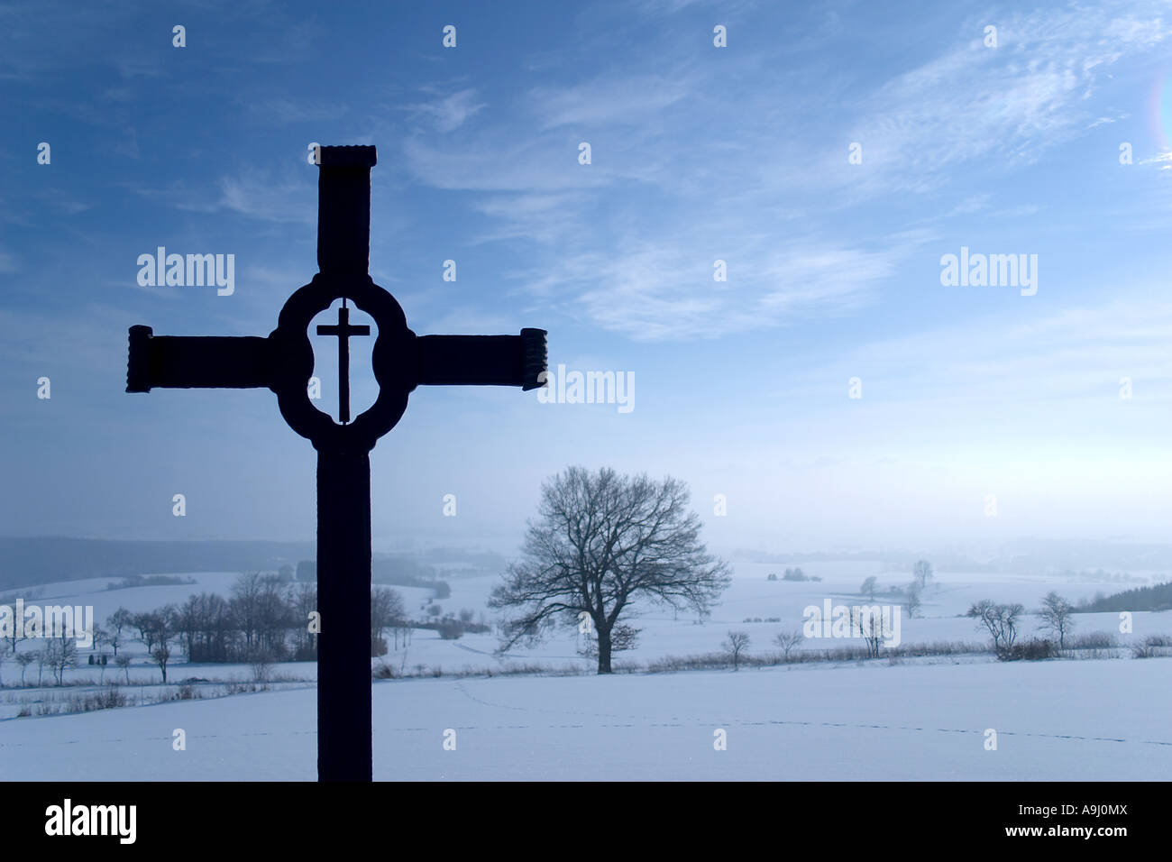 Cross in winter landscape Stock Photo - Alamy