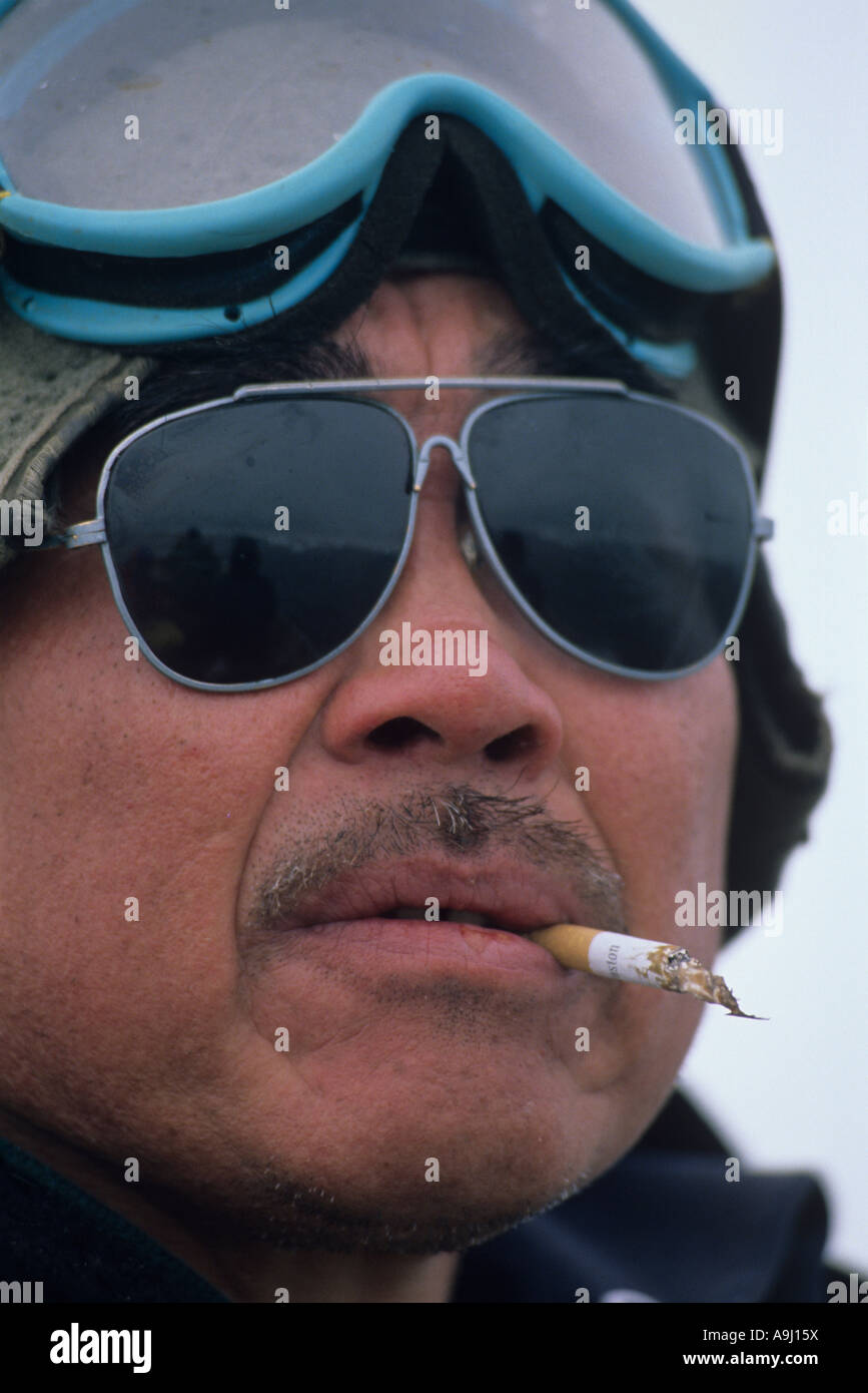 USA Alaska Yupik Eskimo Joseph Henry stands on sea ice during spring ...