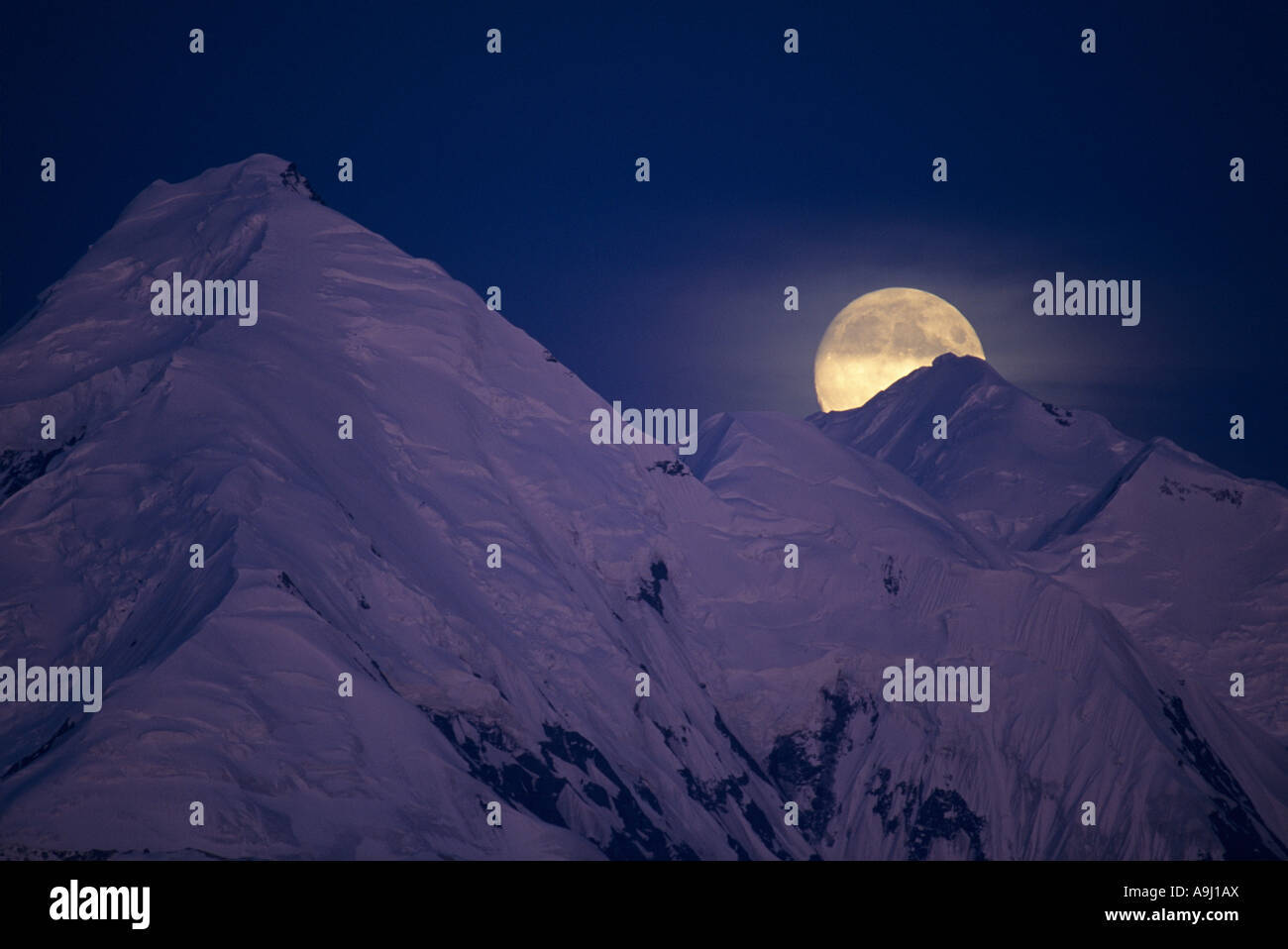 USA Alaska Denali National Park Full moon rises behind Mount Brooks 11 ...
