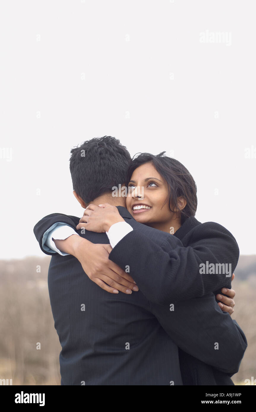 Portrait of couple hugging outdoors Stock Photo - Alamy
