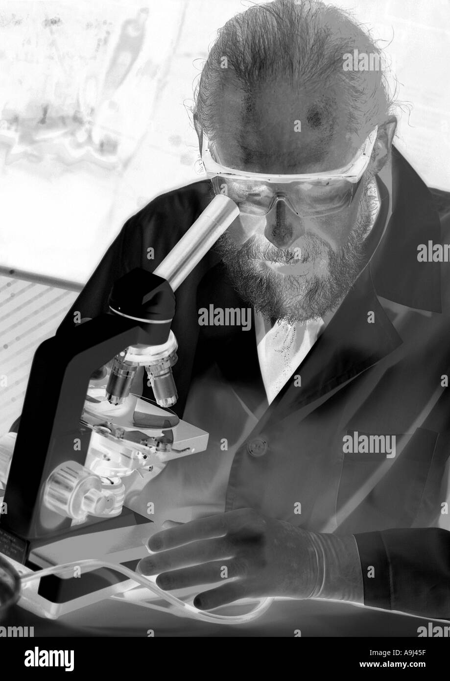 Black man looking through microscope hi-res stock photography and ...