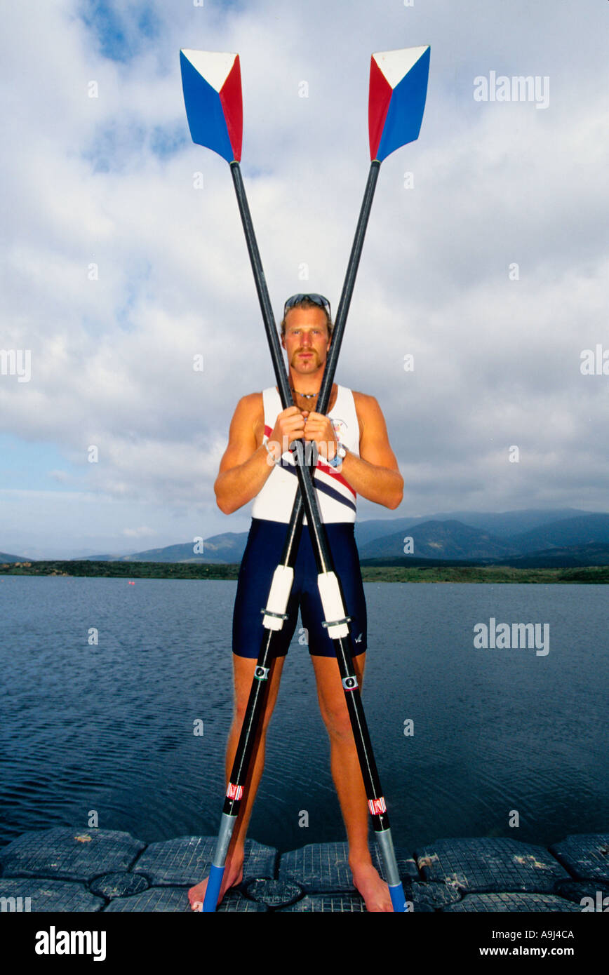 Portrait of a rower with his oars Stock Photo - Alamy