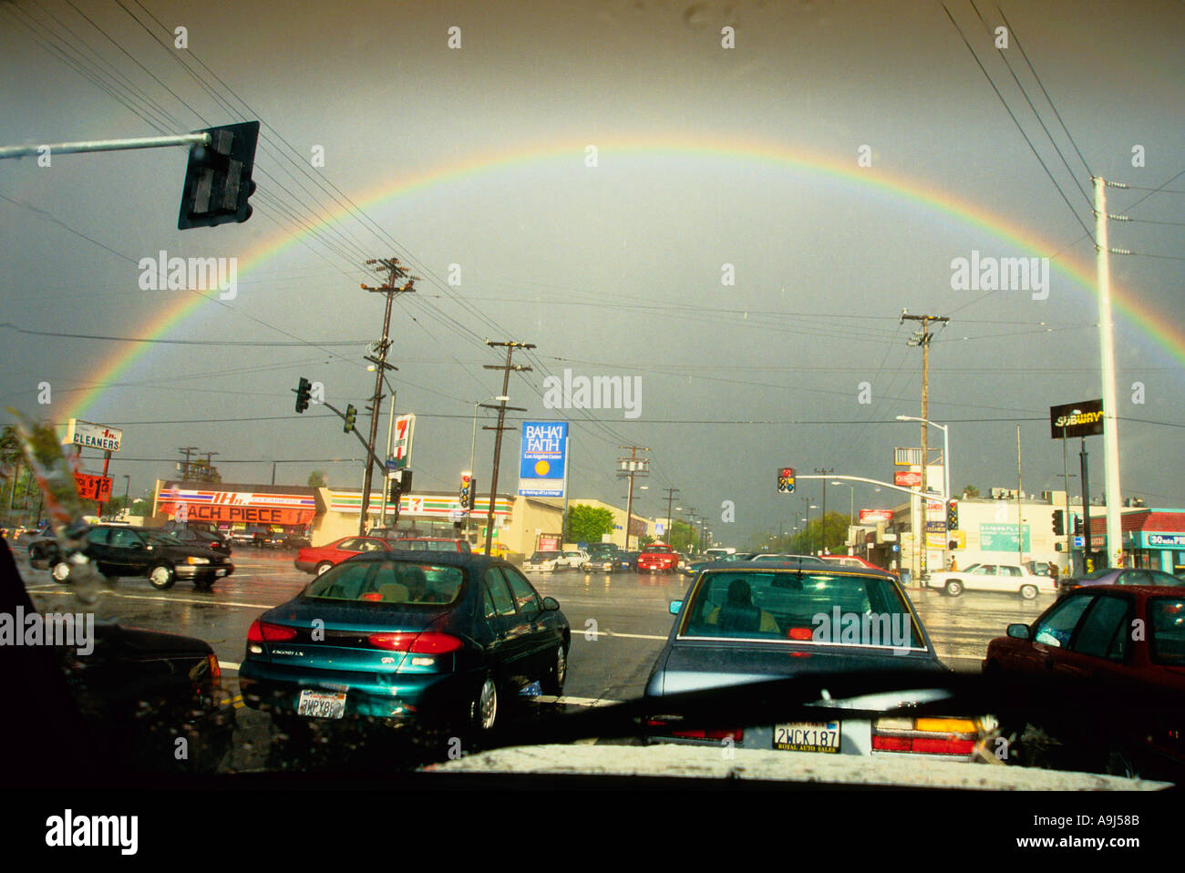 a rainbow on a road trip Stock Photo - Alamy
