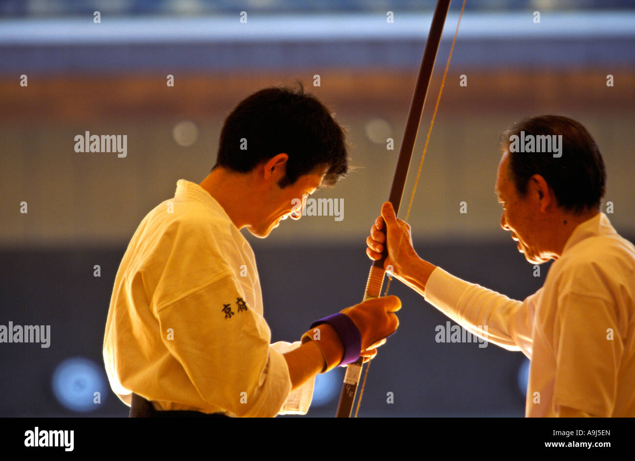 A Kyudo master gives some tuition to a pupil at the Kyoto Budo Centre ...