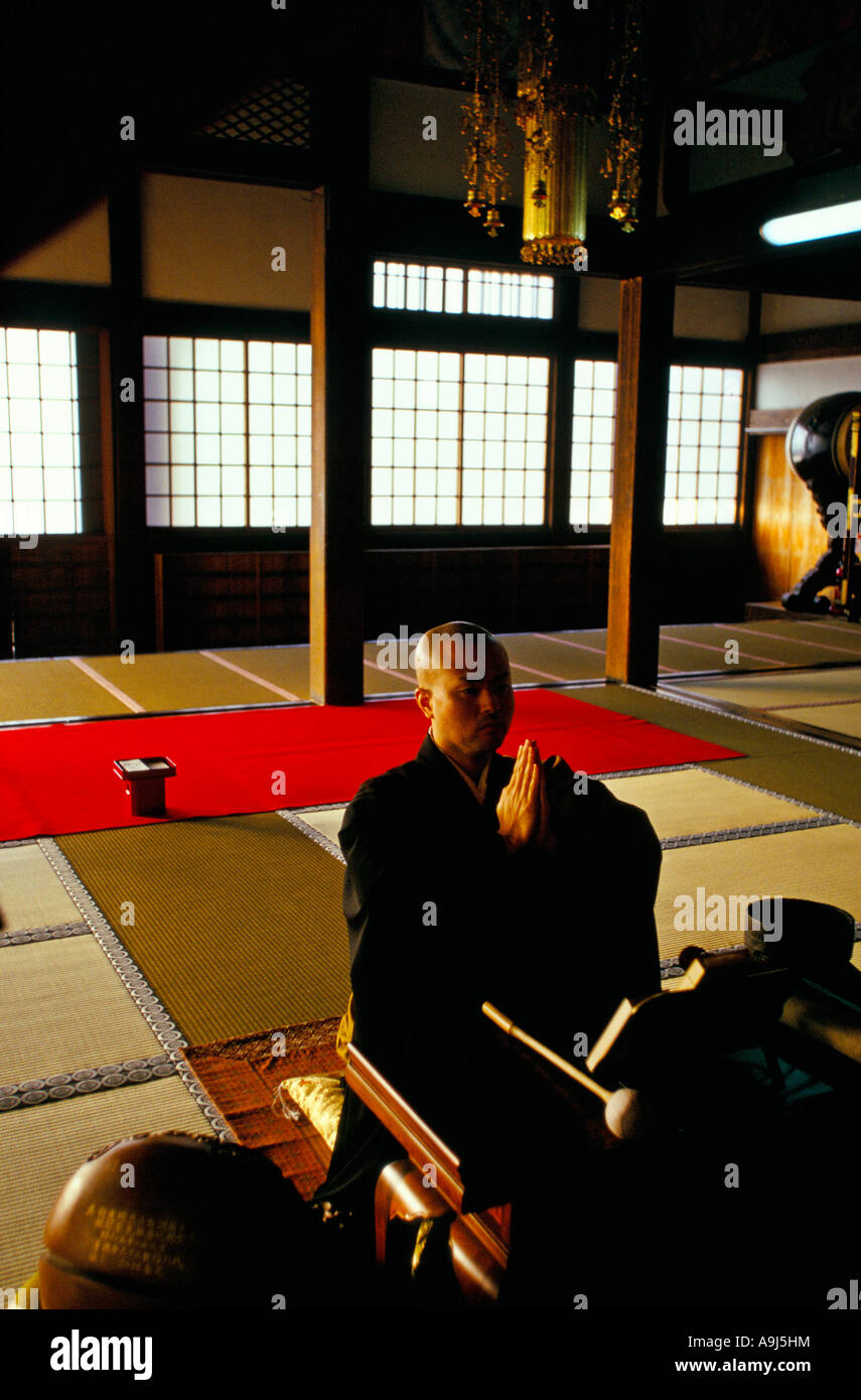 A Zen monk of the Soto School in front of the altar at the Seiryu ji ...